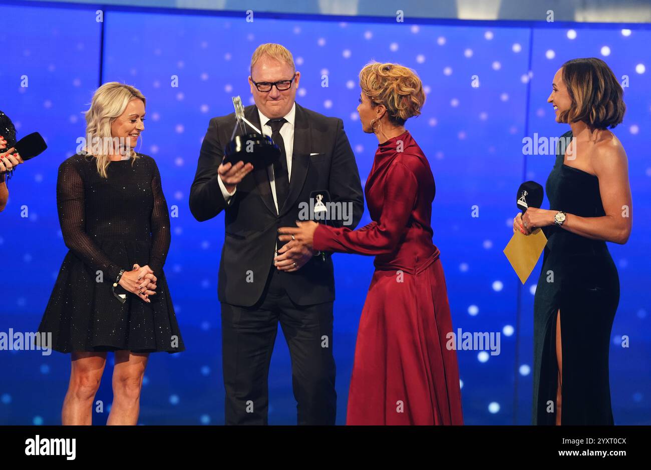 Trevor Painter and Jenny Meadows receive the Coach of the Year award ...