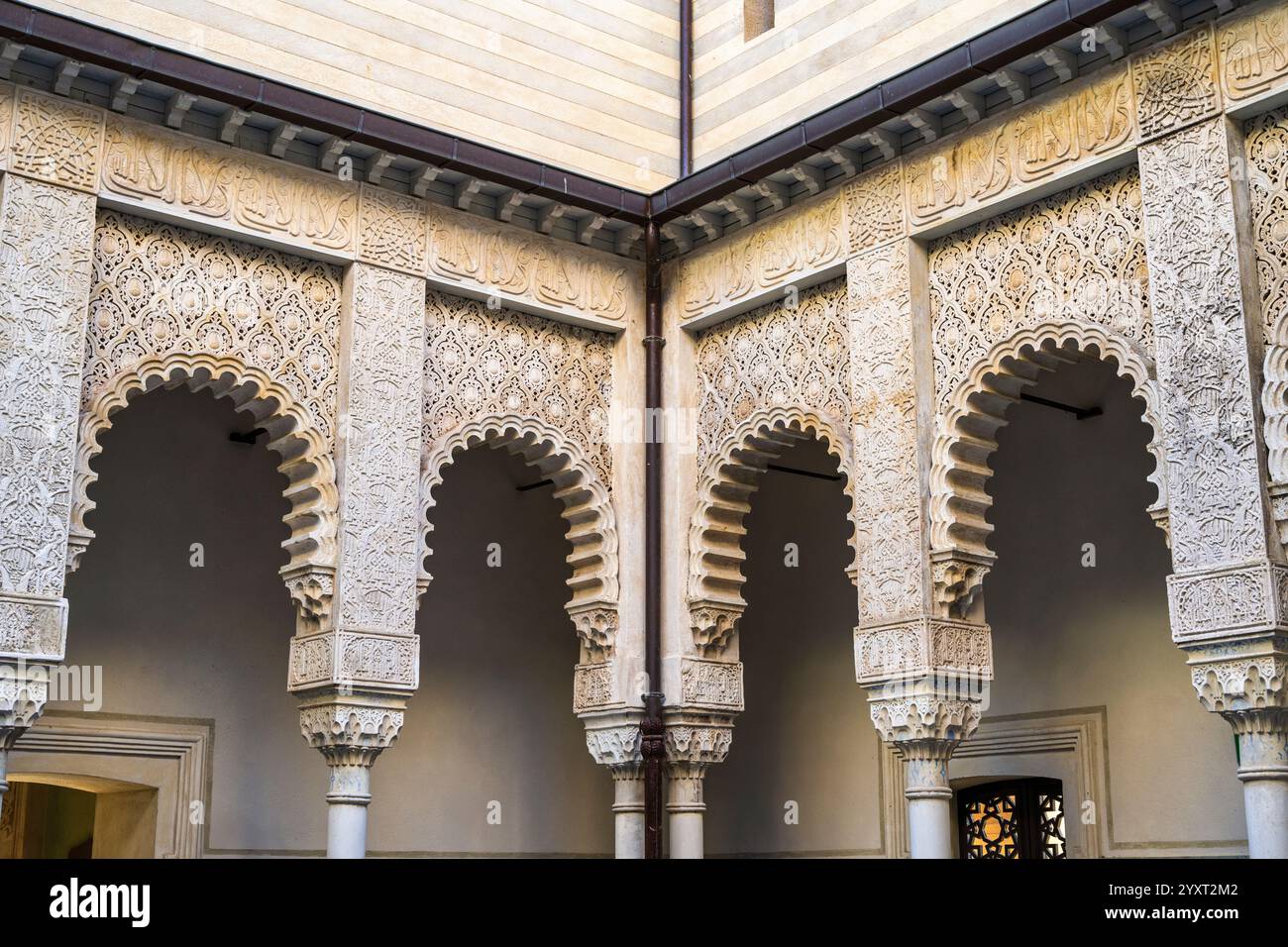 Elaborate arched columns in the Courtyard of the Lions in Rocchetta ...