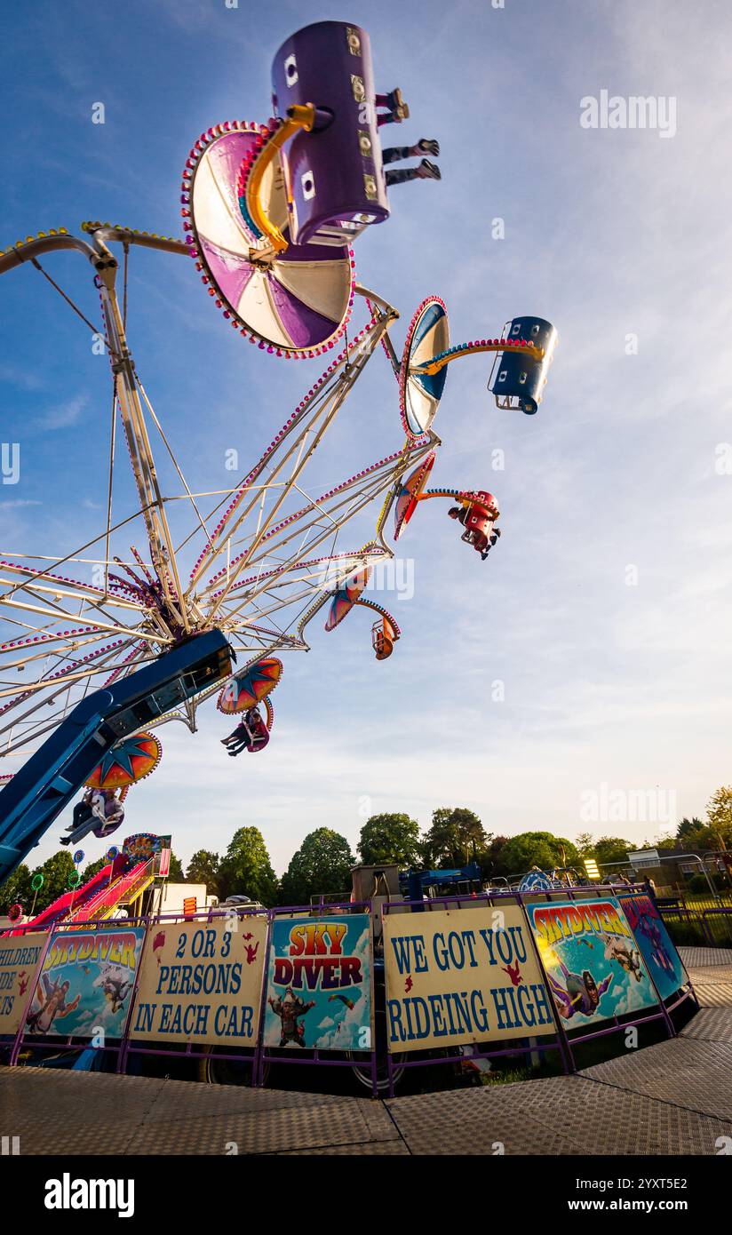 Traditional funfair amusement skydiver paratrooper thrill ride high up ...
