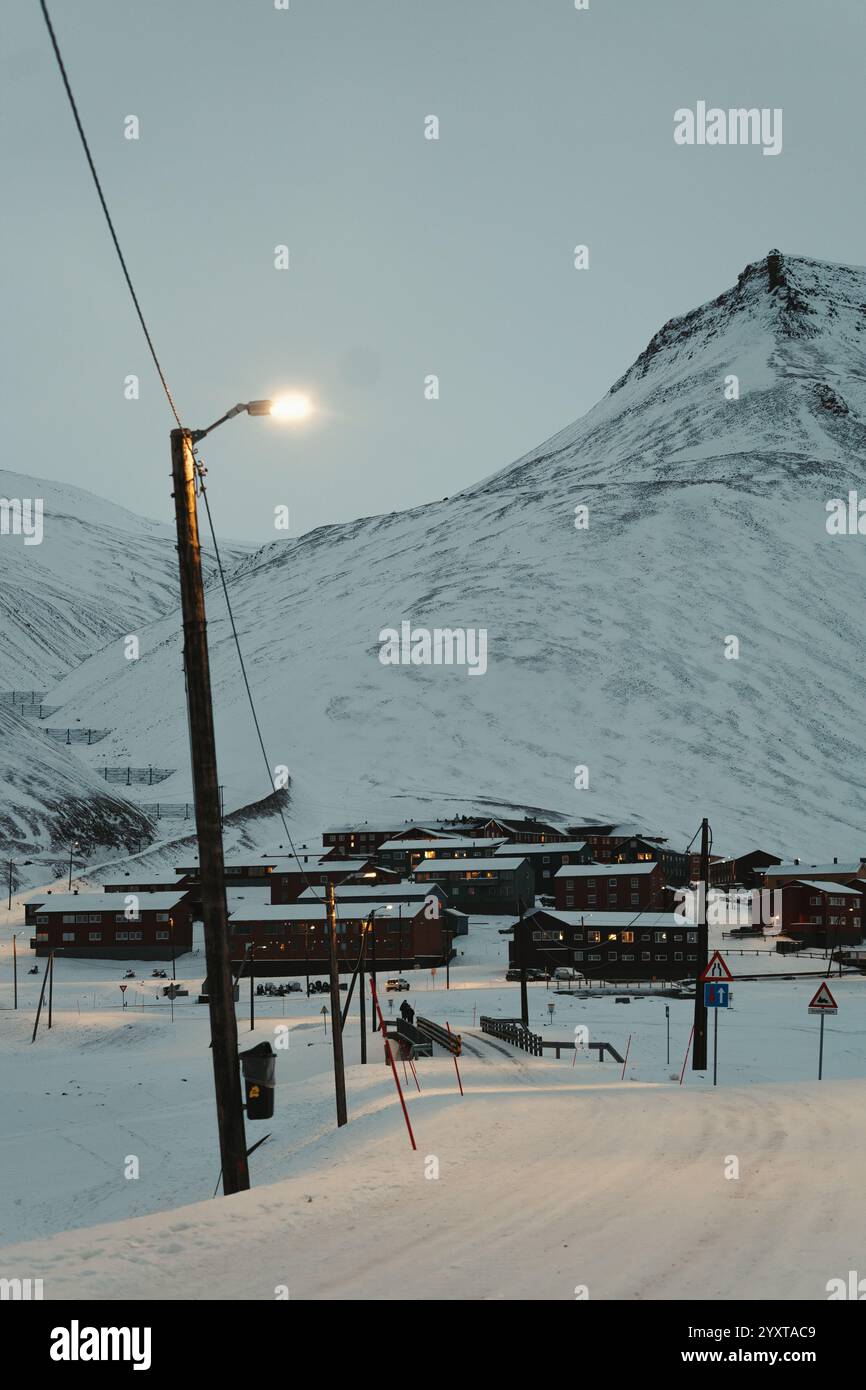 Residential buildings under snowy mountain in Longyearbyen, Svalbard ...