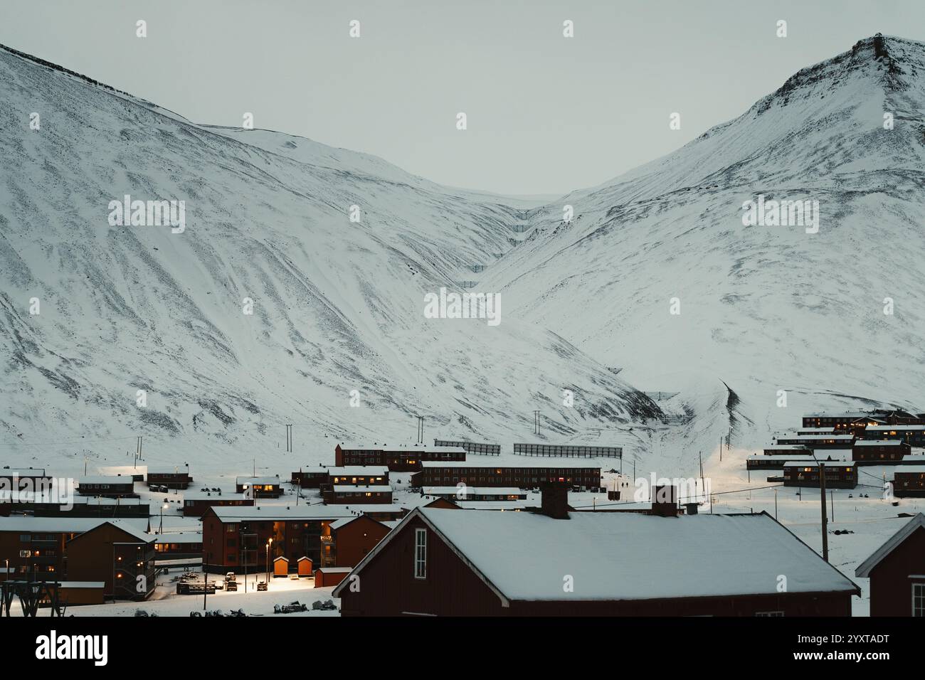 Apartment buildings in snowy valley in Longyearbyen, Svalbard under ...