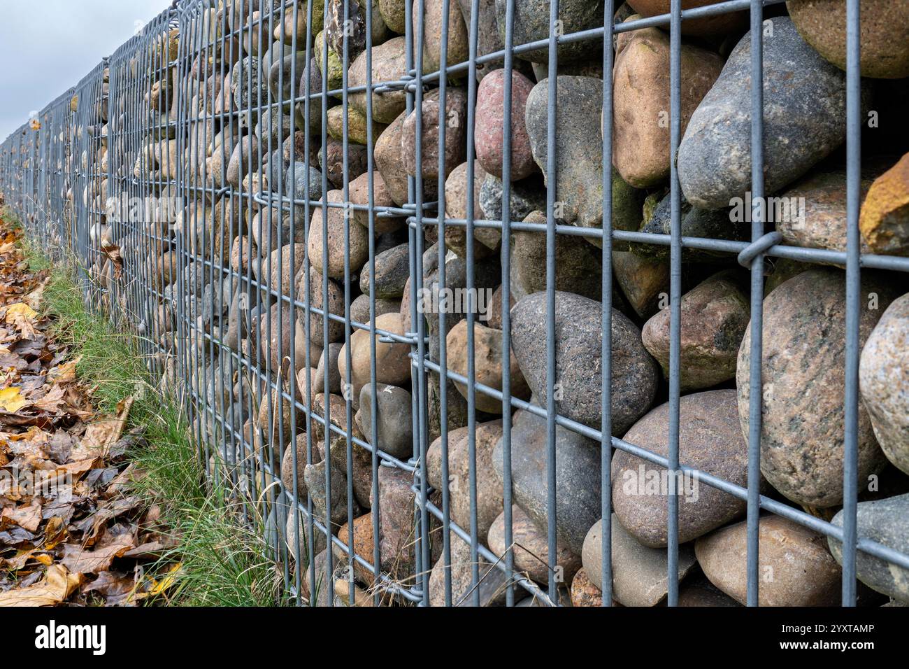 gabion fence filled with stones from the Baltic Sea Stock Photo - Alamy