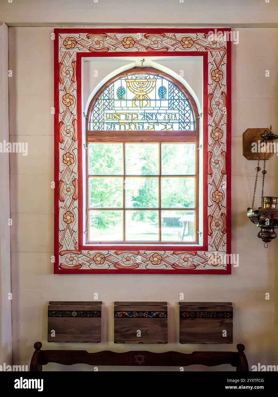Sanok, Poland - May 4, 2024. Brightly lit colorful stained glass ...