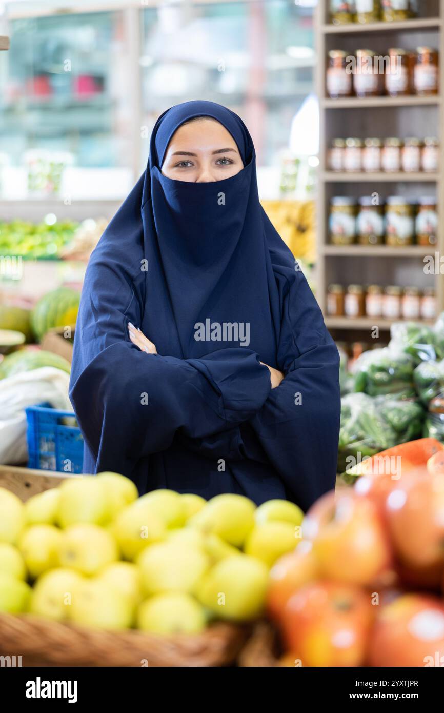 Portrait of a positive contented woman in a veil in supermarket Stock ...