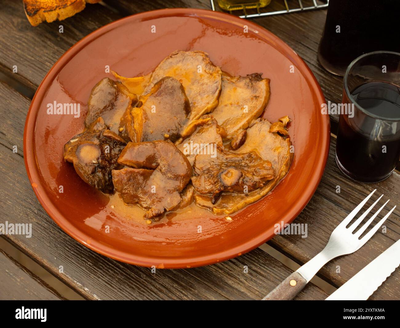 Plate contains pieces of veal beef tenderloin cooked in creamy sauce ...