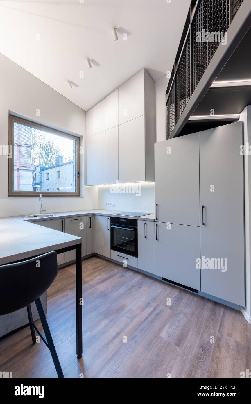 Bright and elegant modern kitchen featuring minimalist style ...