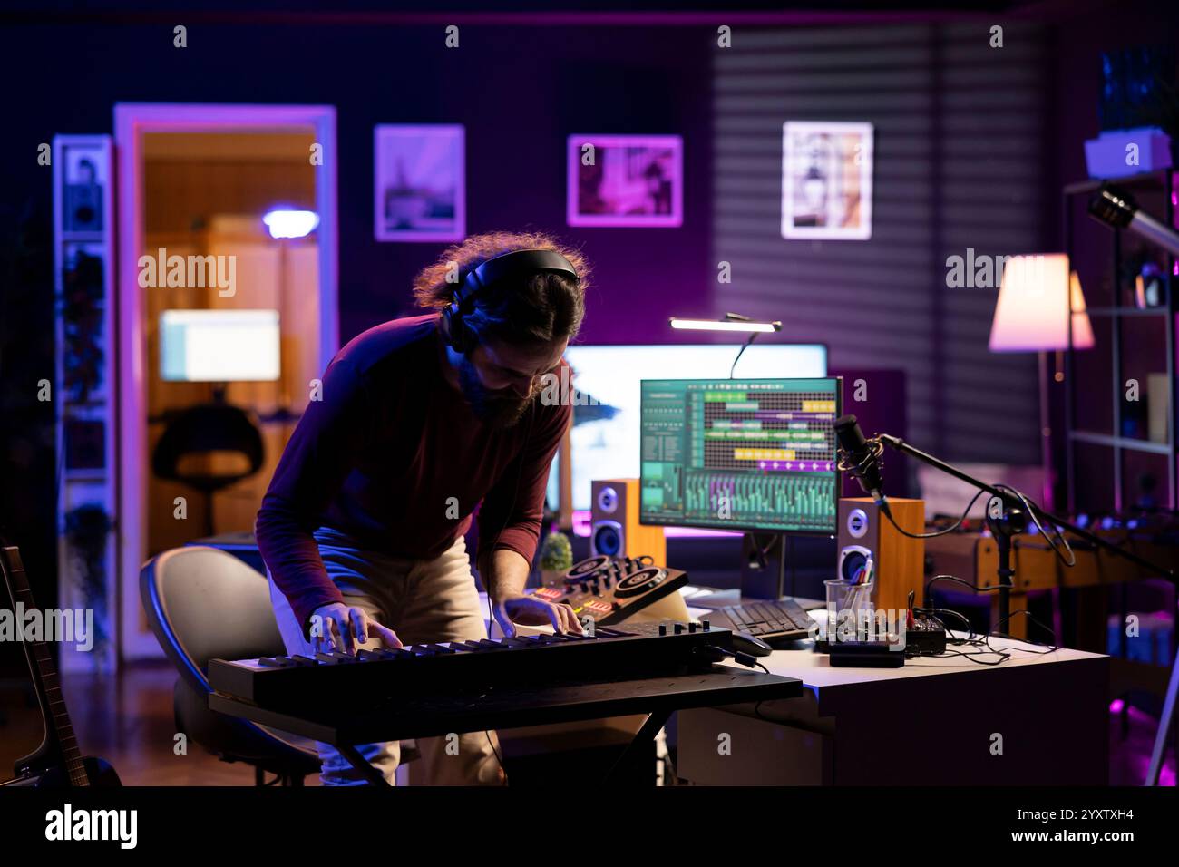 Confident singer playing new song on electronic piano keyboard in home ...