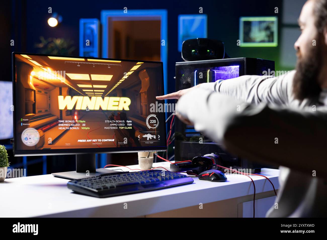 Joyous gamer celebrating after winning esports match during livestream ...