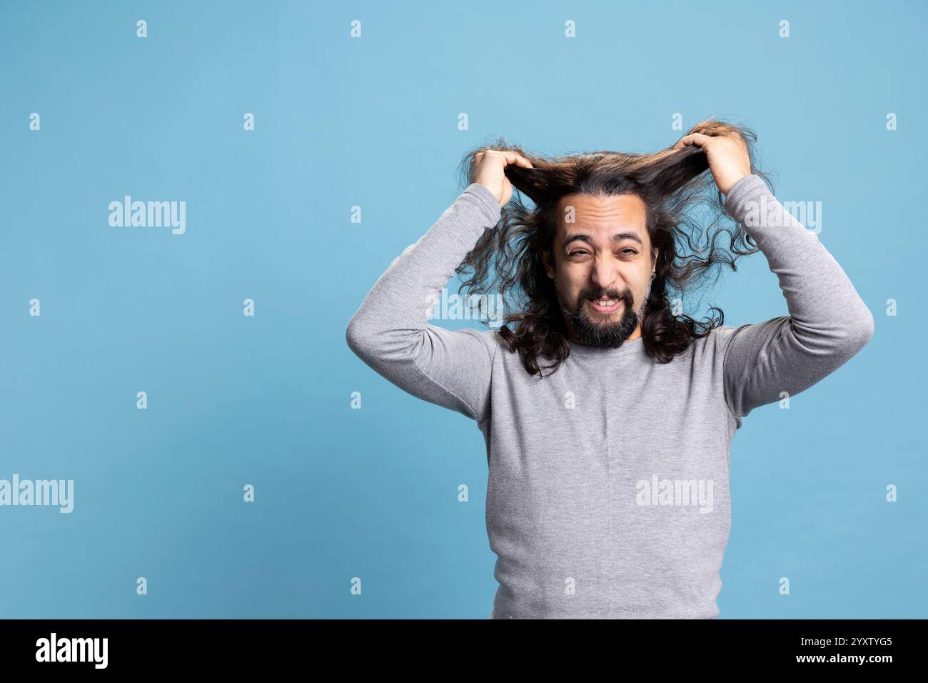 Middle eastern guy acting desperate and pulling his hair out on camera ...