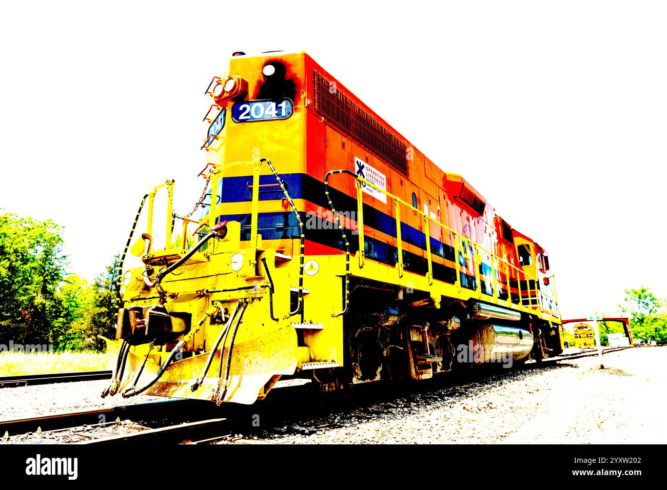 Colorful, powerful looking train engine parked in the railroad switch ...