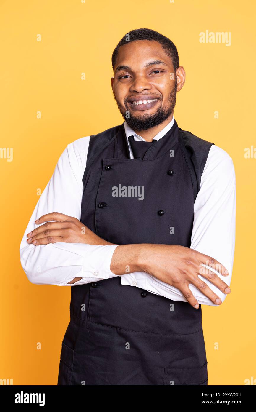 Portrait of restaurant waiter wearing professional uniform and apron ...
