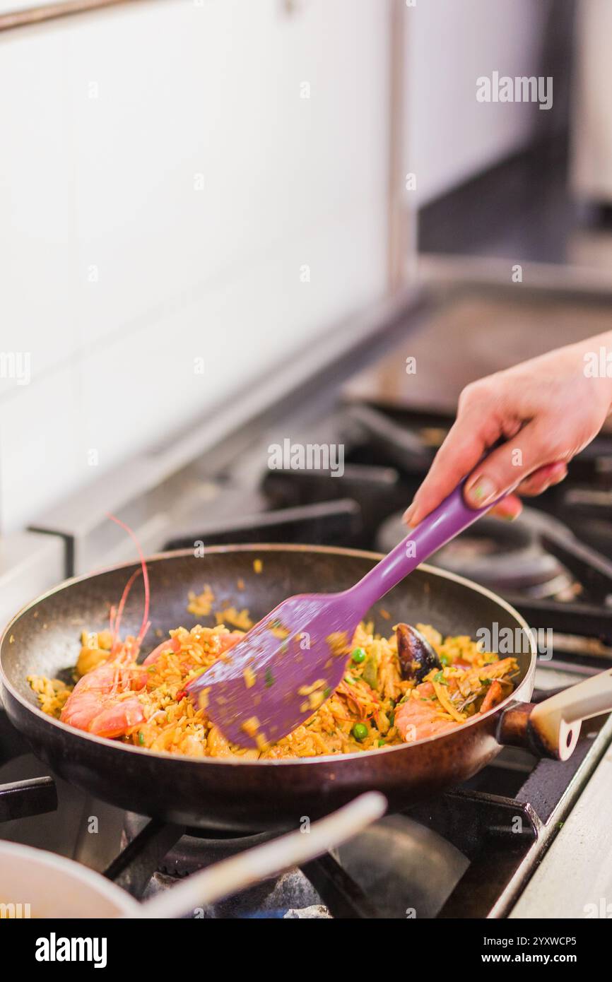 Chef cooking traditional ecuadorian seafood rice dish in madrid ...