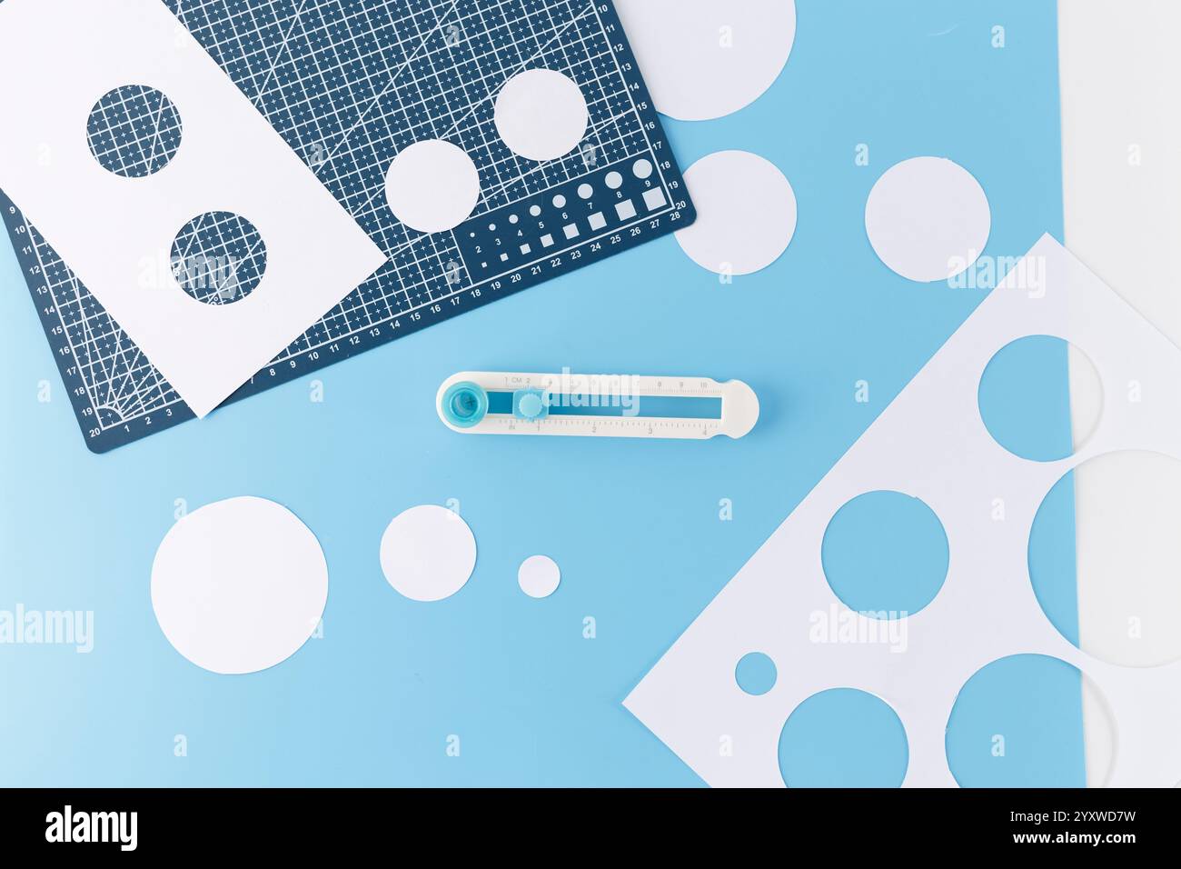 Collection of crafting tools and materials for cutting circles ...