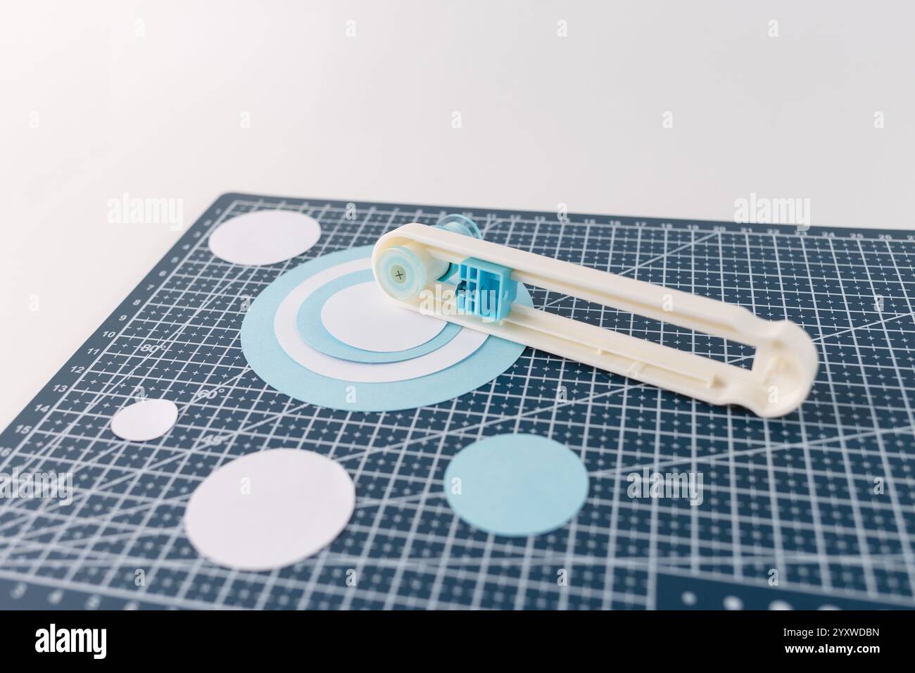 upside down view of Paper circle cutter tool. Close-up. Manual rotary ...