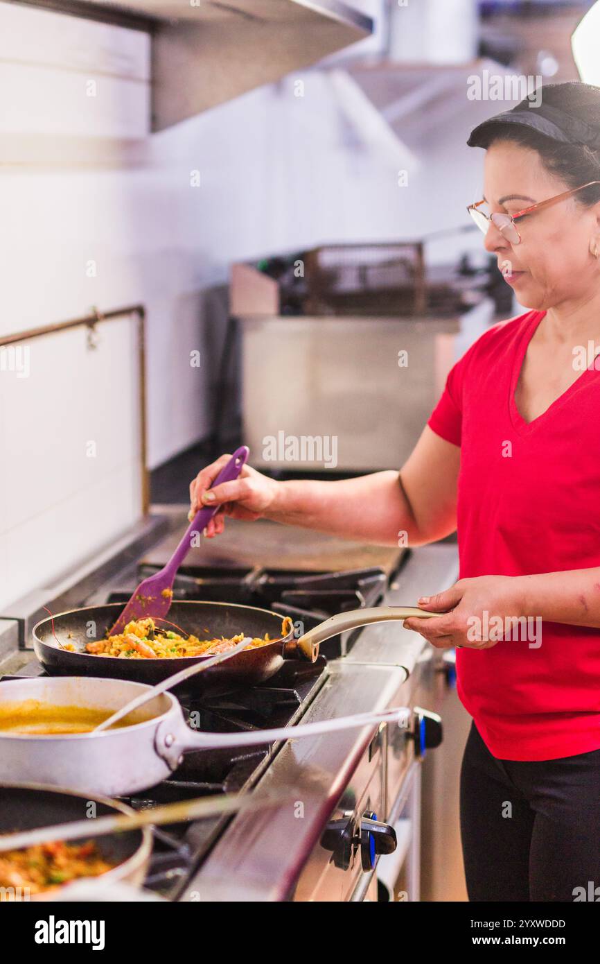 Latin american chef cooking traditional ecuadorian food in restaurant ...