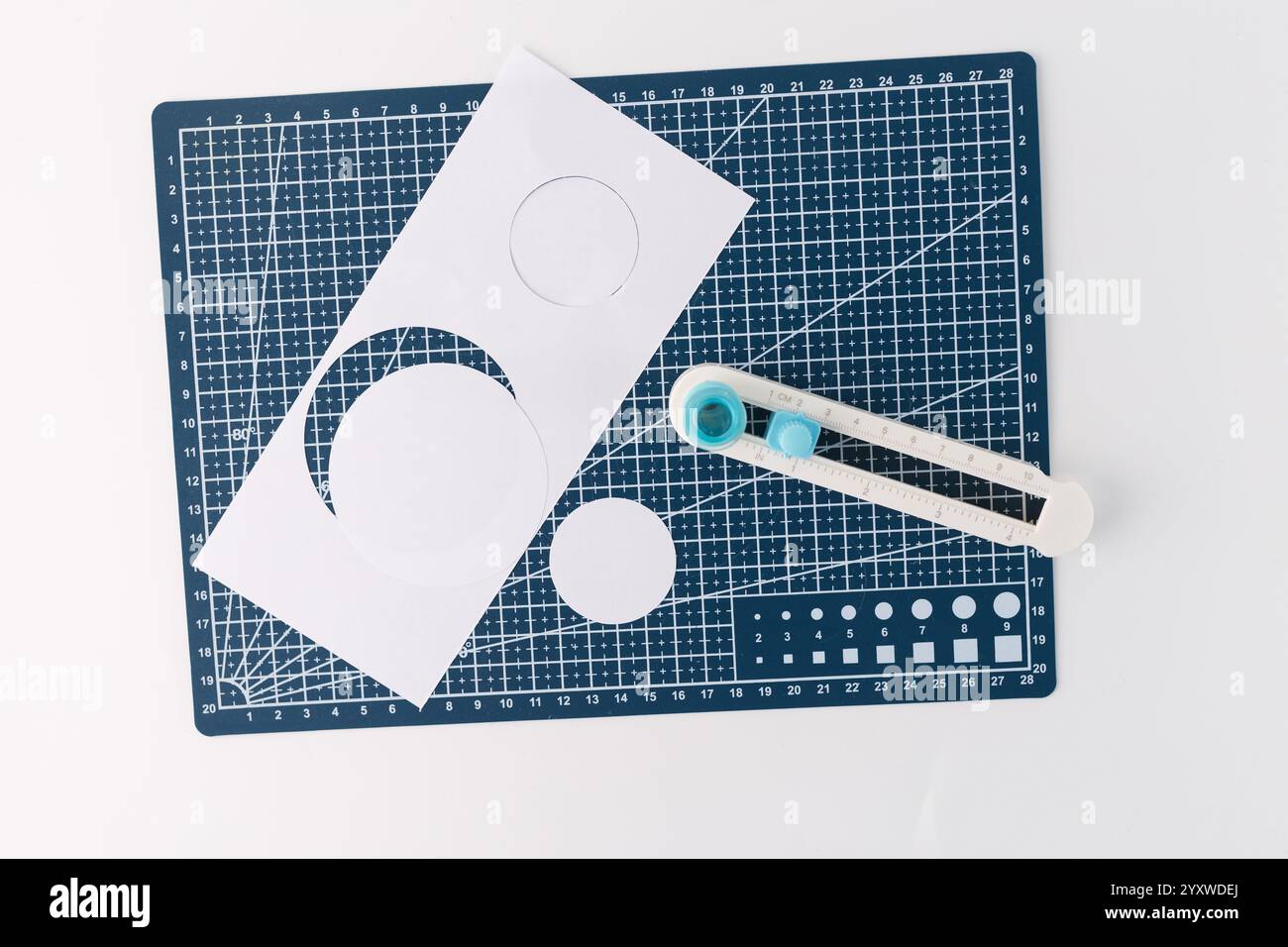 The circle cutter tool has a sliding mechanism with measurements in ...