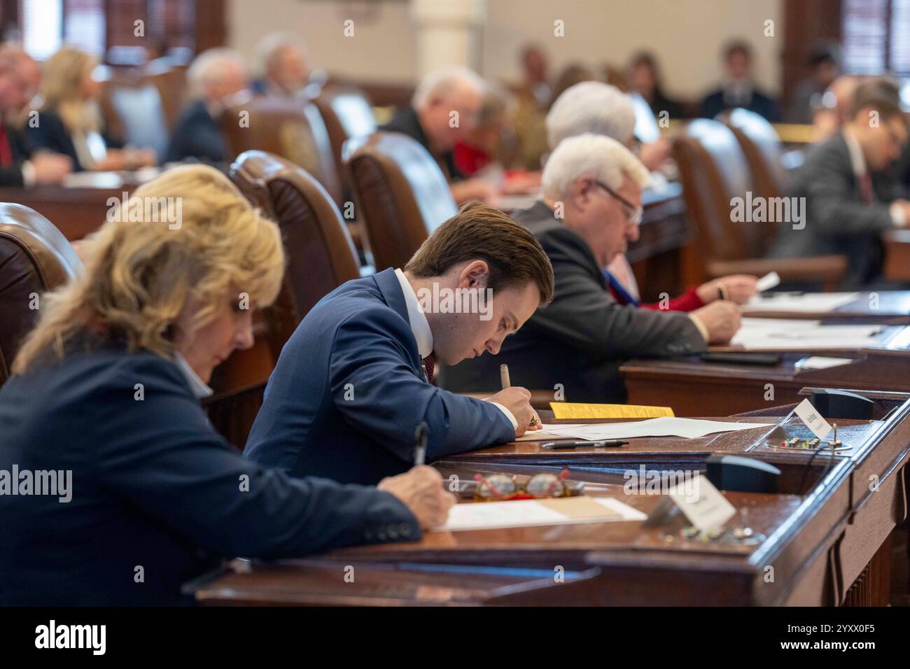 Austin, Tx, USA. 17th Dec, 2024. Elector KADEN MATTINGLY casts his vote ...