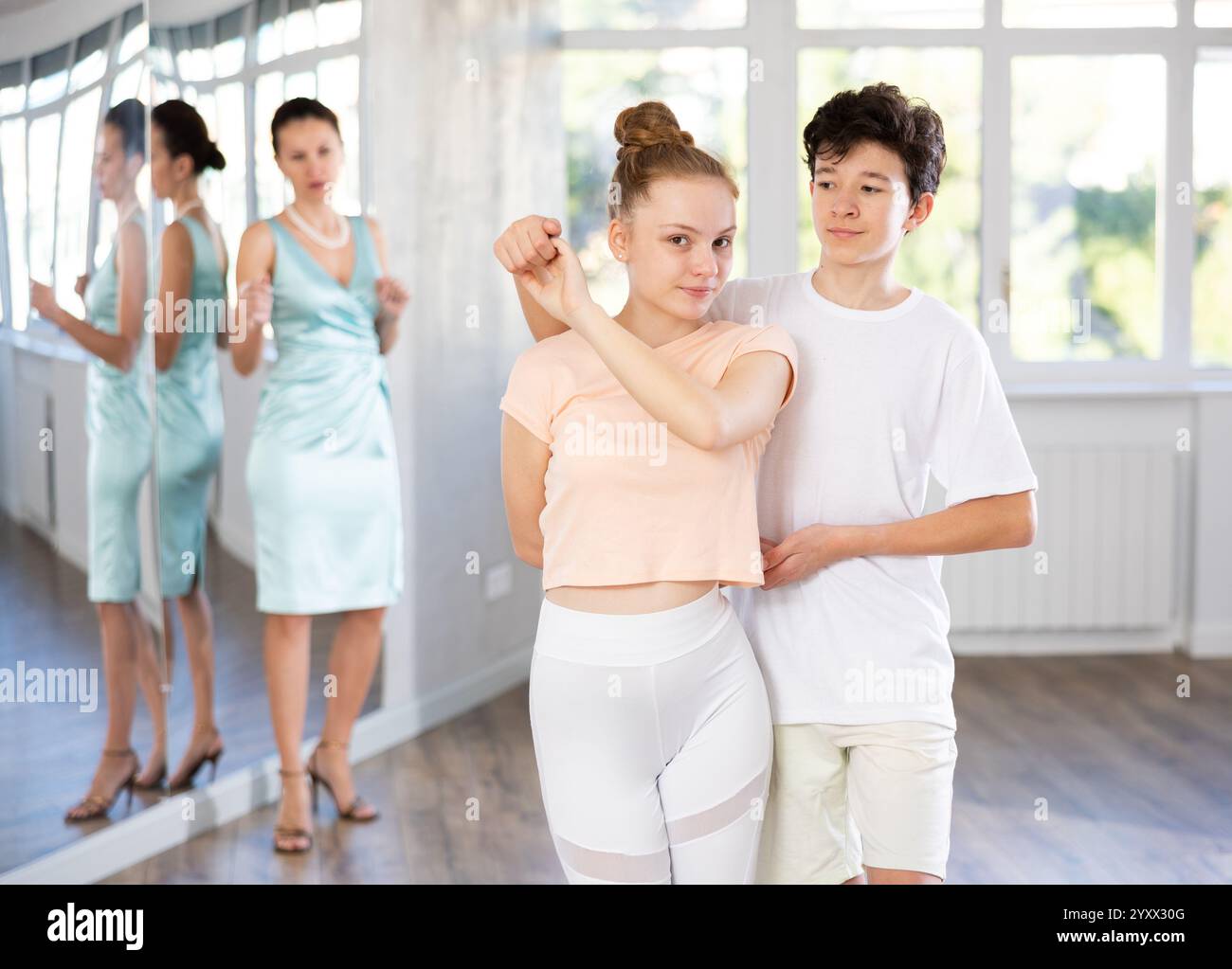 Girl and boy dancing slow ballroom dance in choreography studio Stock ...