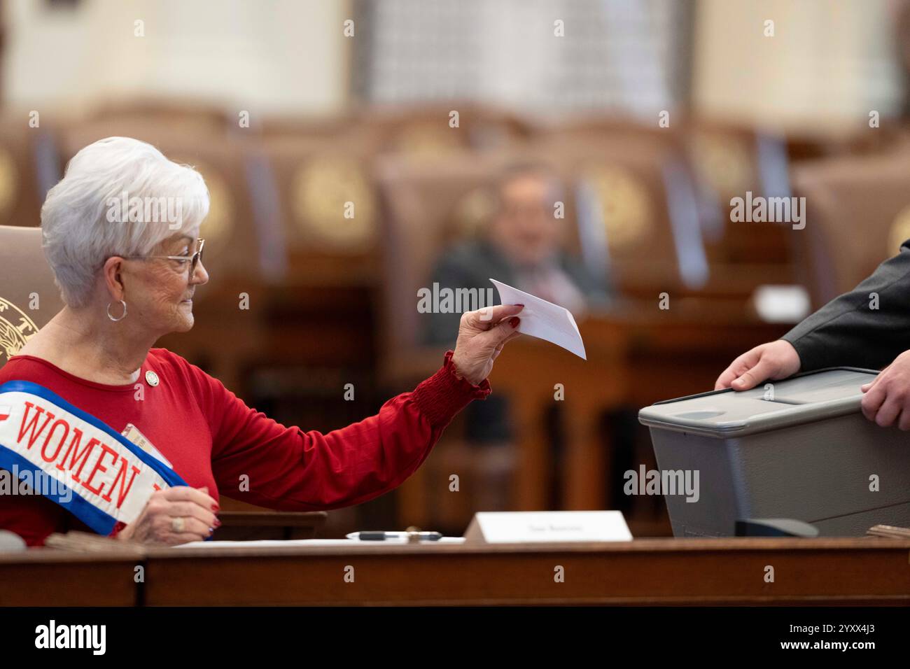 December 17, 2024, Austin, Texas, USA: Elector SUE REEVES casts her ...