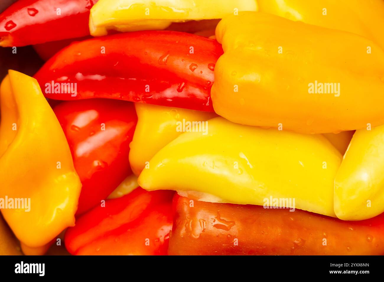 A variety of peppers in bright colors including red, yellow, and orange ...