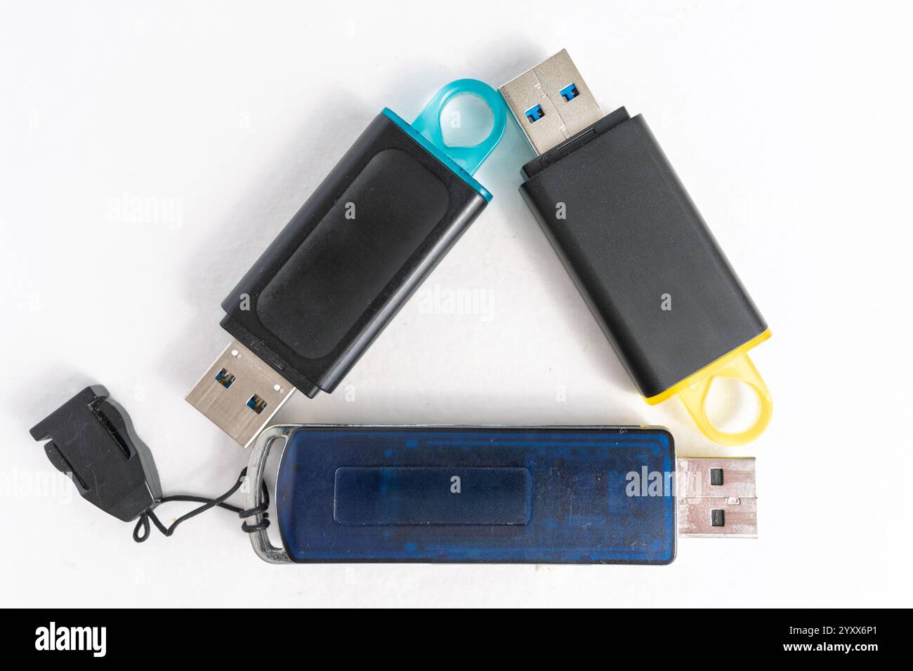 Various USB flash drives of different colors and designs are placed on ...