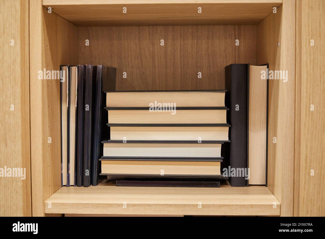 Books on a shelf Stock Photo - Alamy