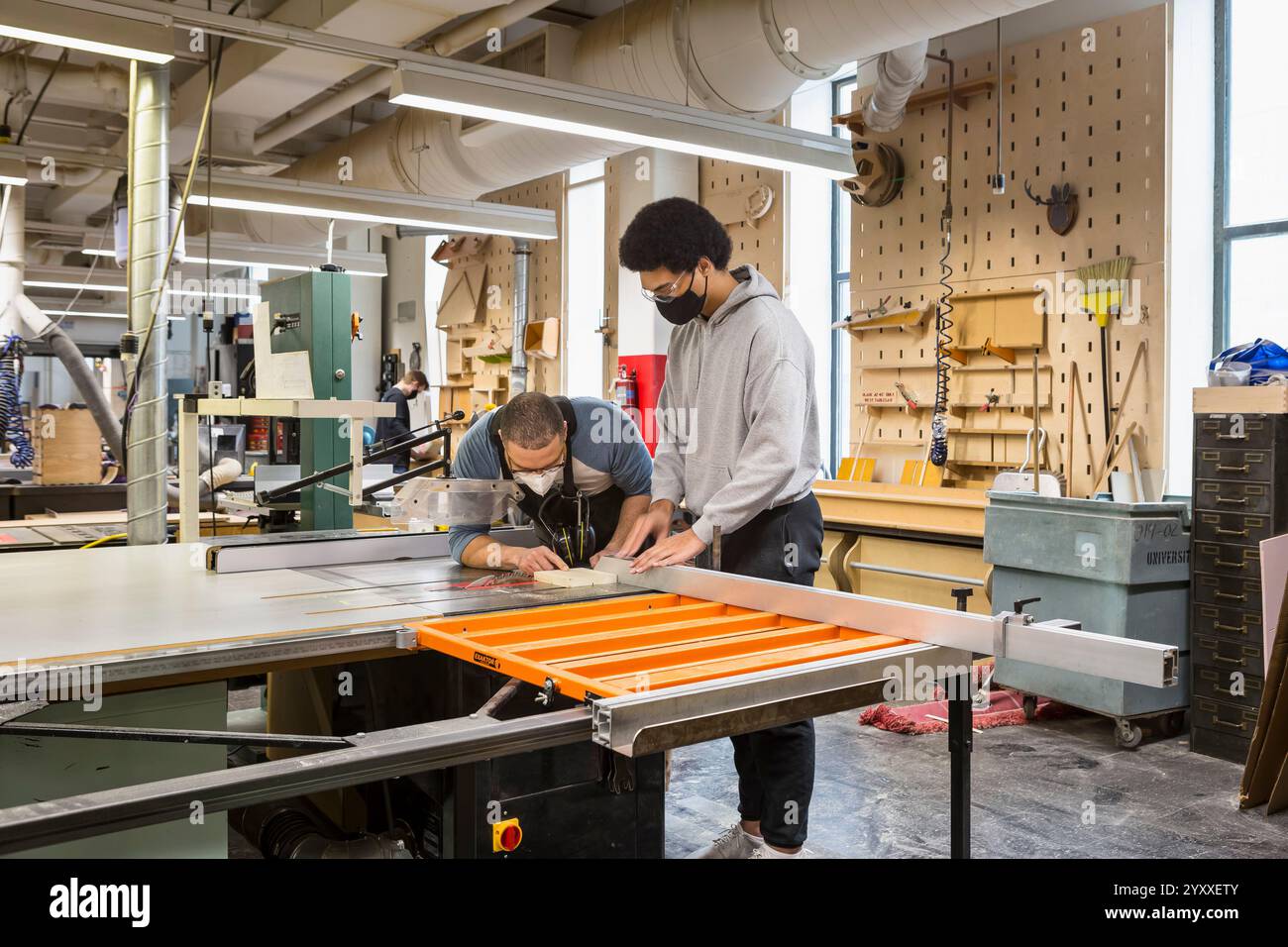 Students and instructors working in a university architecture school ...