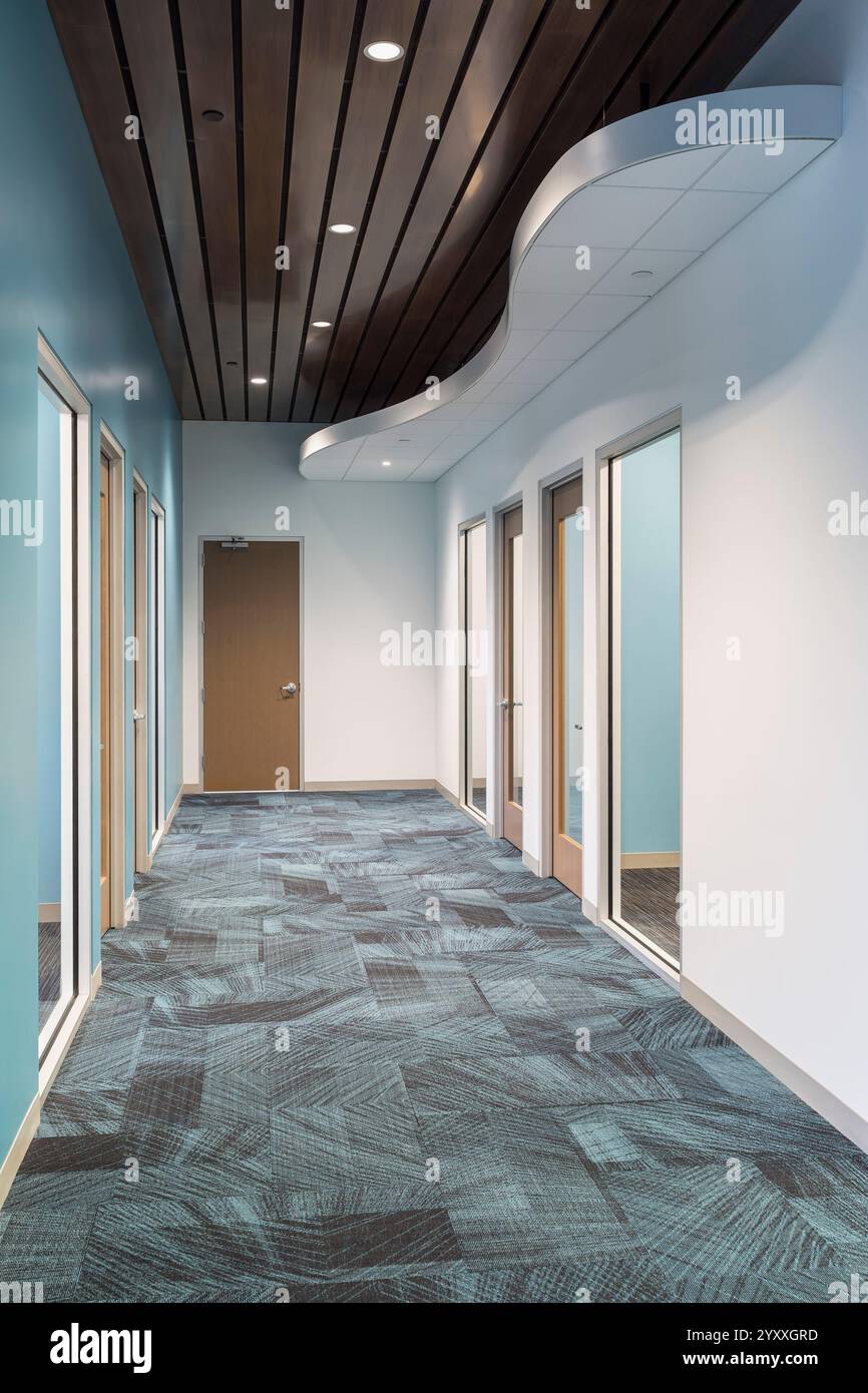 Hallway in acoustics business with interesting ceiling treatments Stock ...