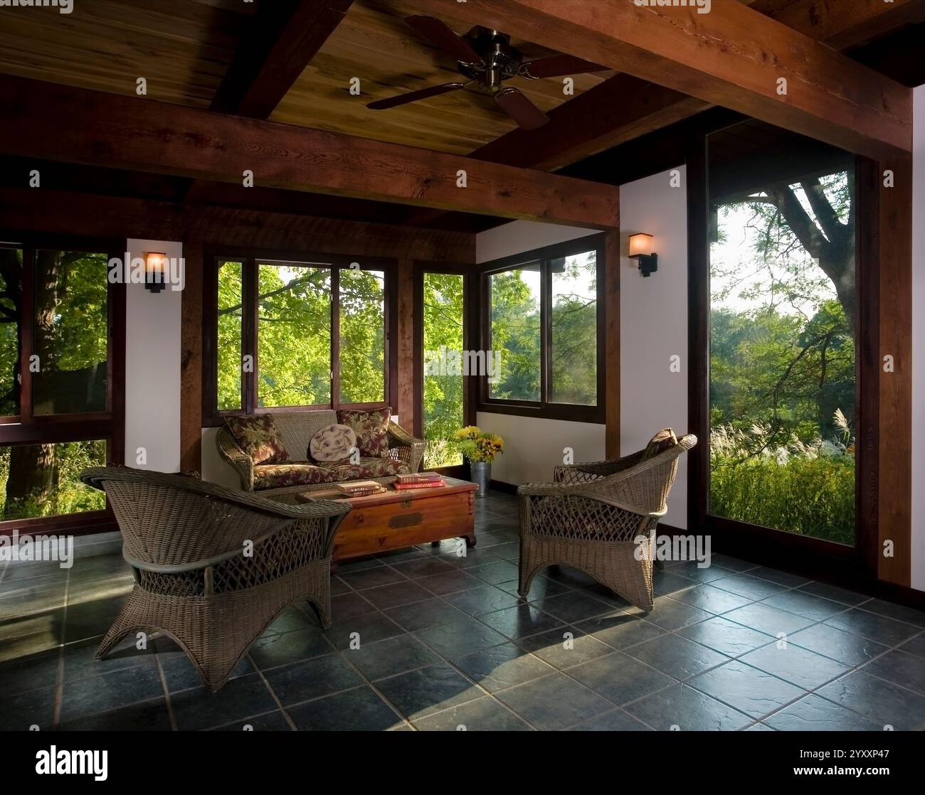 Interior of four season porch with tile floor and floor to ceiling ...
