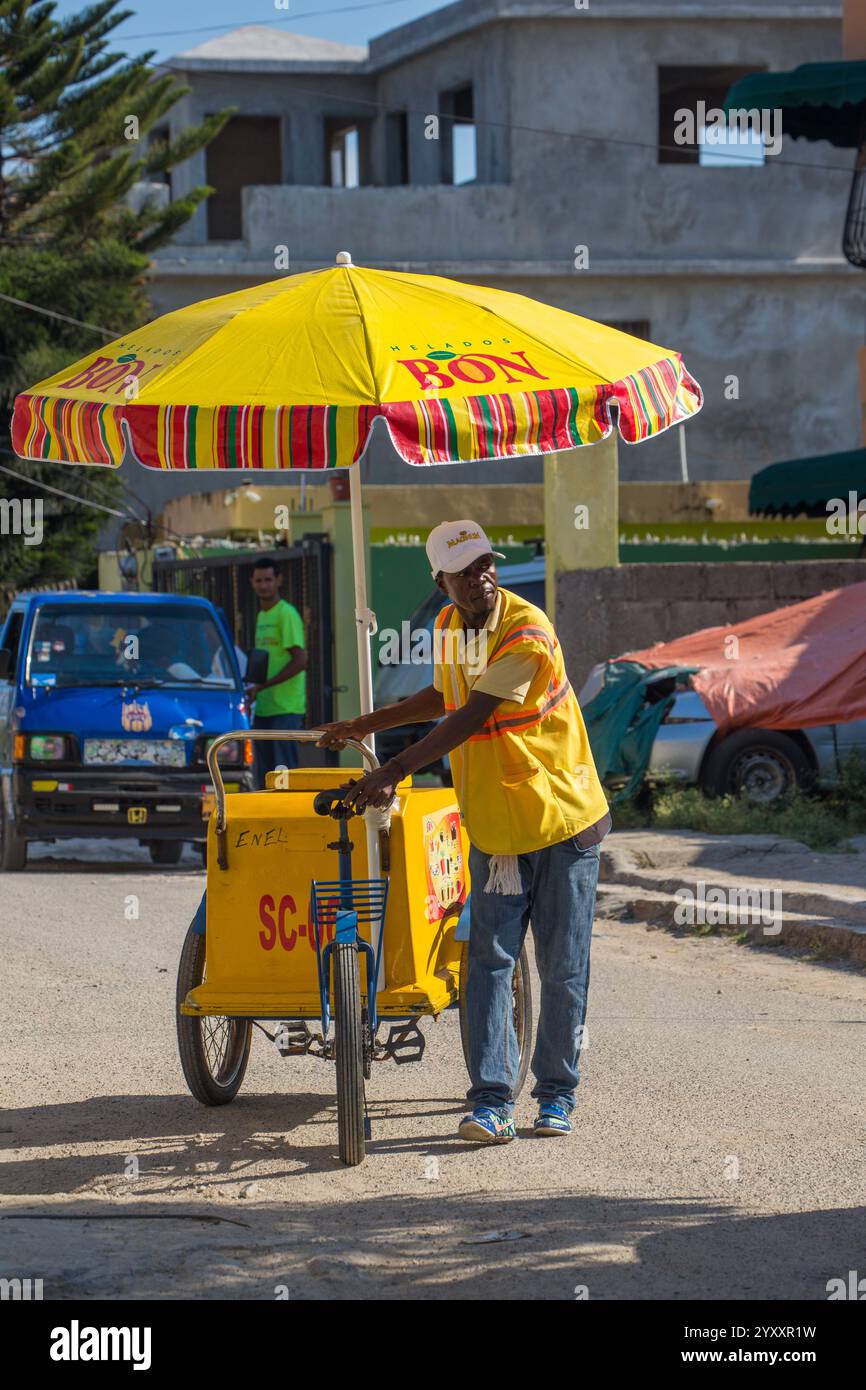 Vendor selling ice cream on the street from a mobile cart. Photographed ...