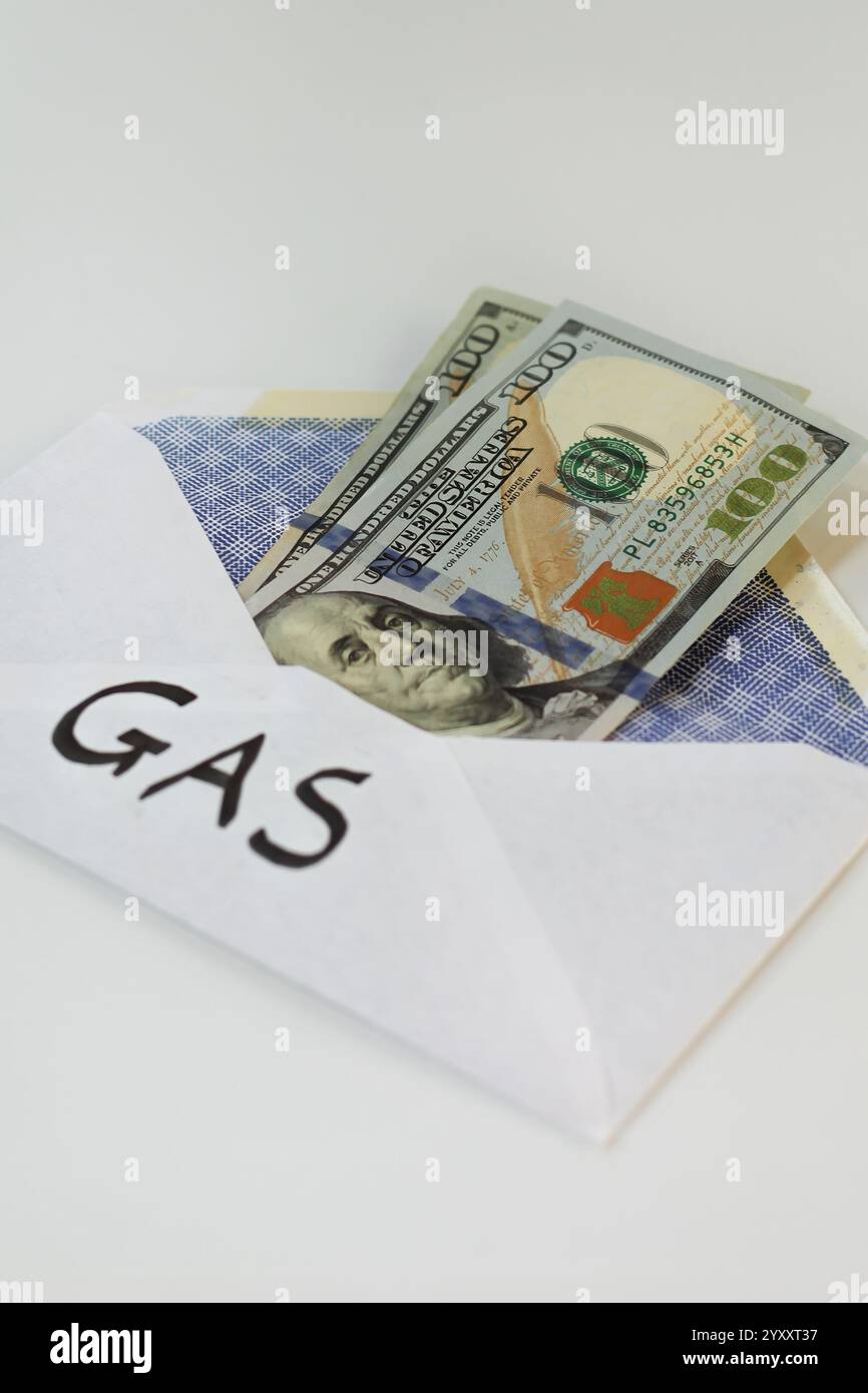 100 dollar bills in gas envelope, budgeting concept Stock Photo - Alamy
