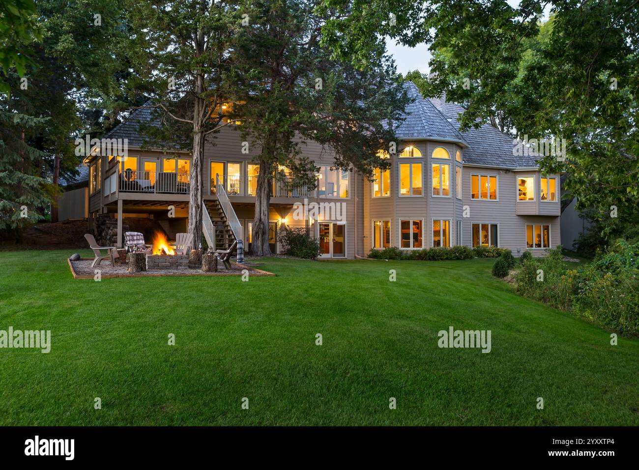 House at dusk has interior lights on hi-res stock photography and ...