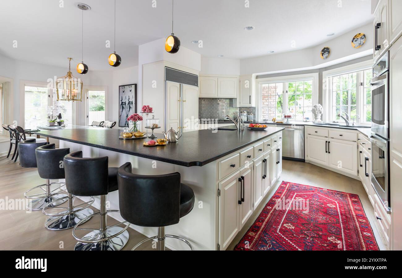 Small black and gold pendant lights over eating area countertop hi-res ...