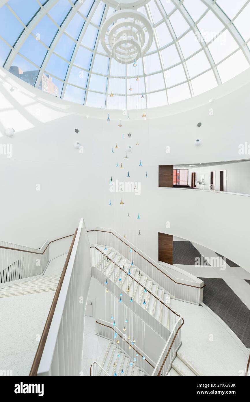 Trinity Stairwell under glass dome with modern circular light fixture ...