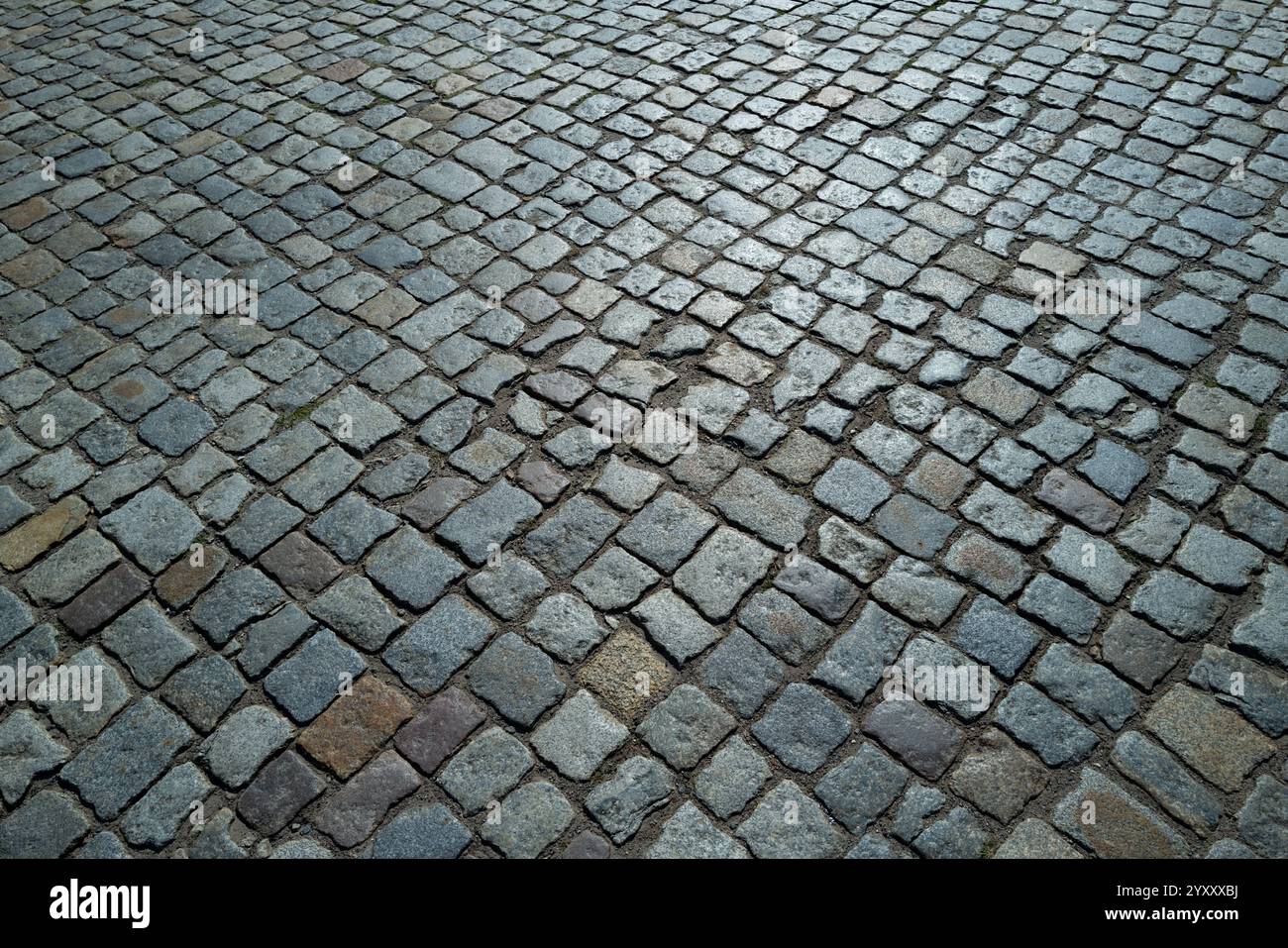 Background of bricks road. Background with bricks road. Stone cladding ...
