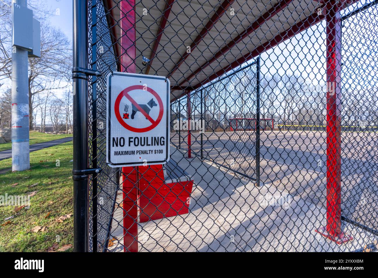 Close up photo of dog waste sign, No Fouling, hung on a black chain ...