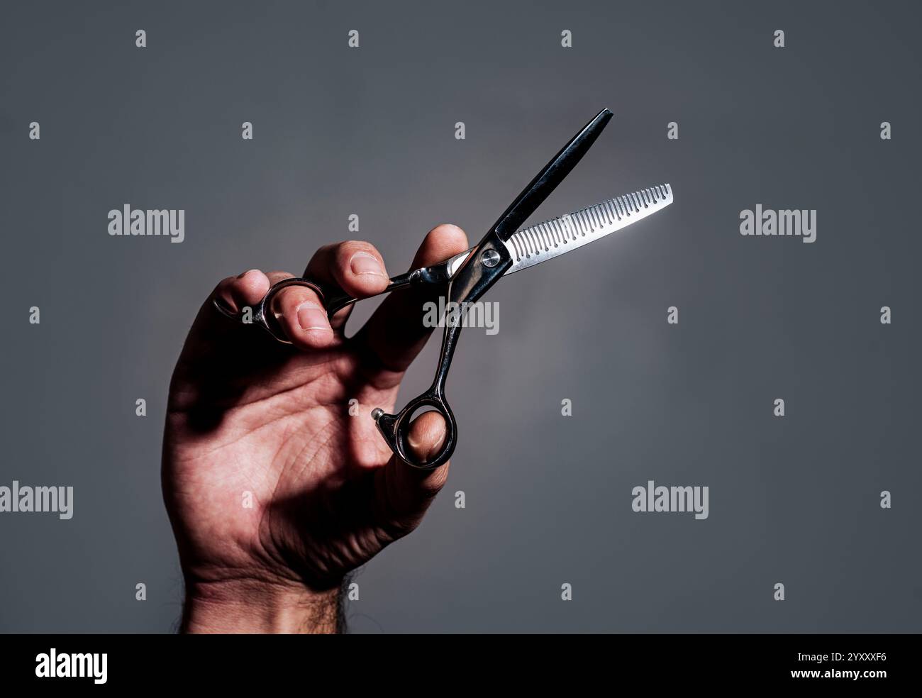 Barber holding scissors in salon hi-res stock photography and images ...