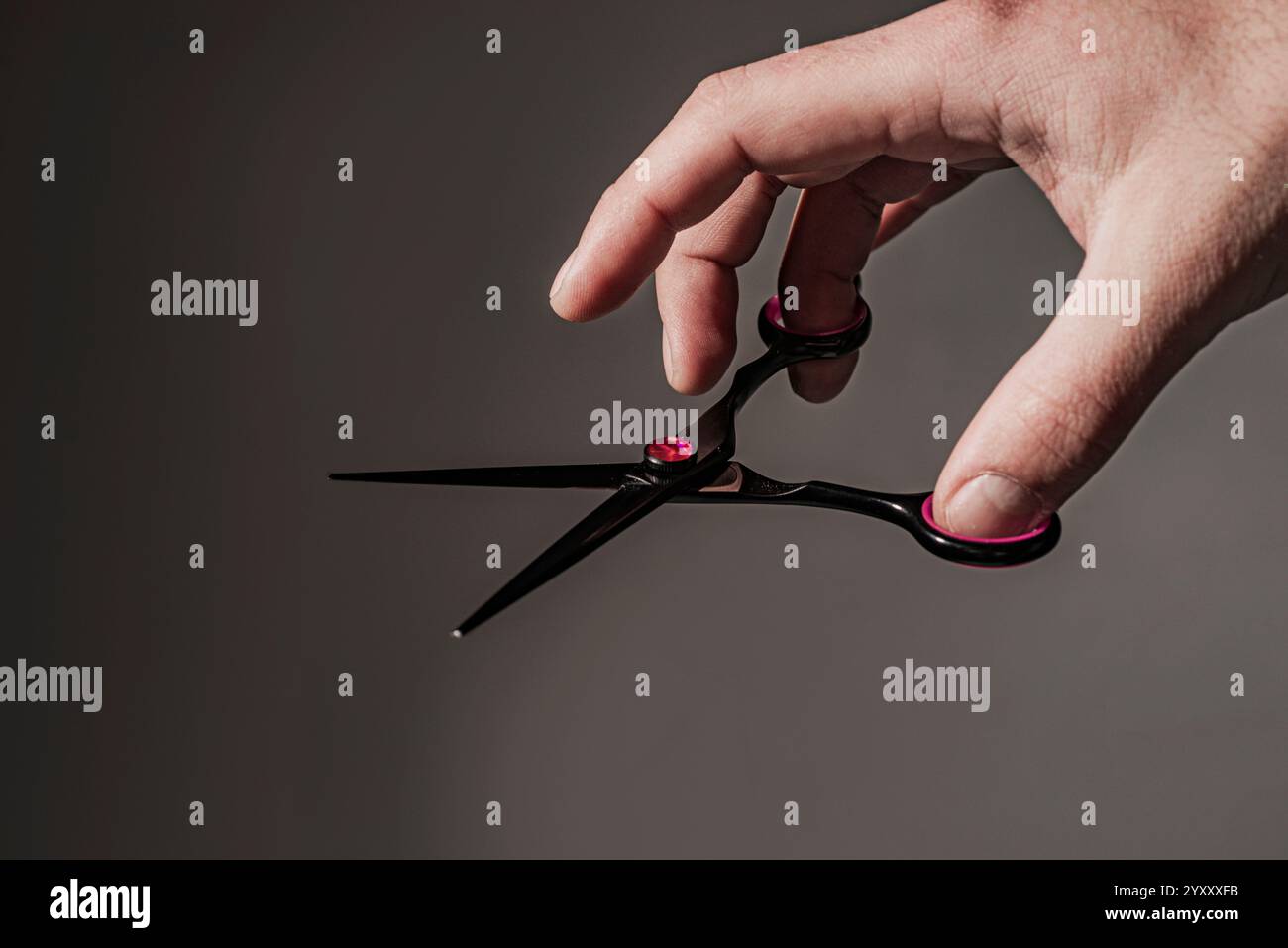 Barbershop background. Man holding scissors. Barber scissors ...