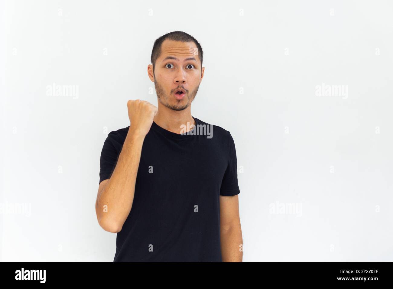 Young men is posing winning gesture with palm fist hand with black ...