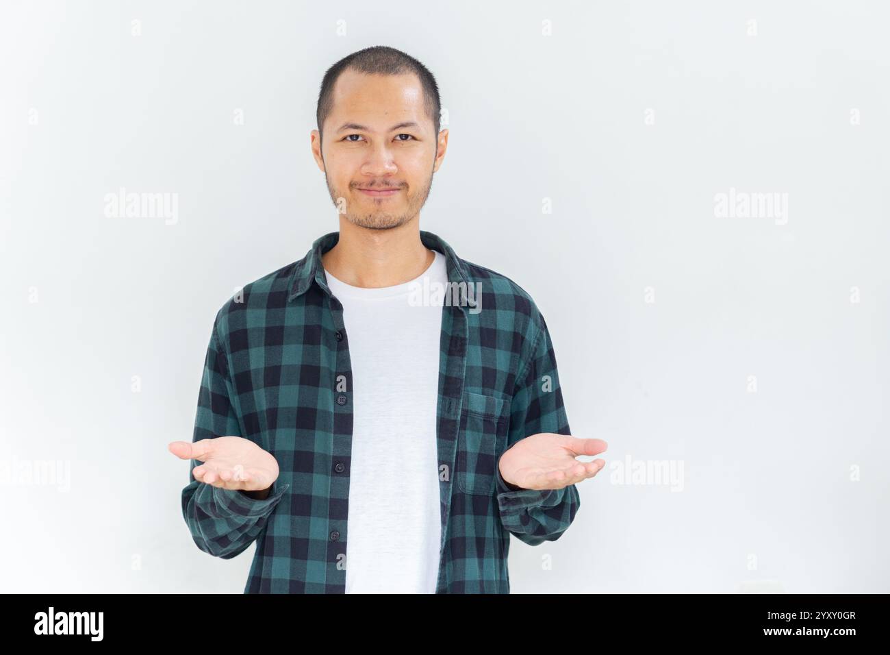 Young asian men with flannel and shirt is presenting with opened hand ...