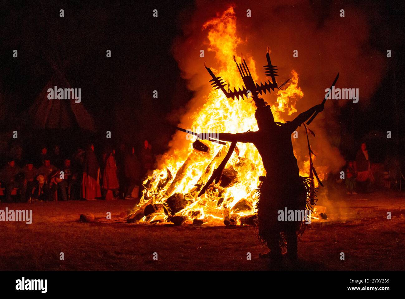 An Apache Crown Dancer whirls around the bonfire during a coming-of-age ...
