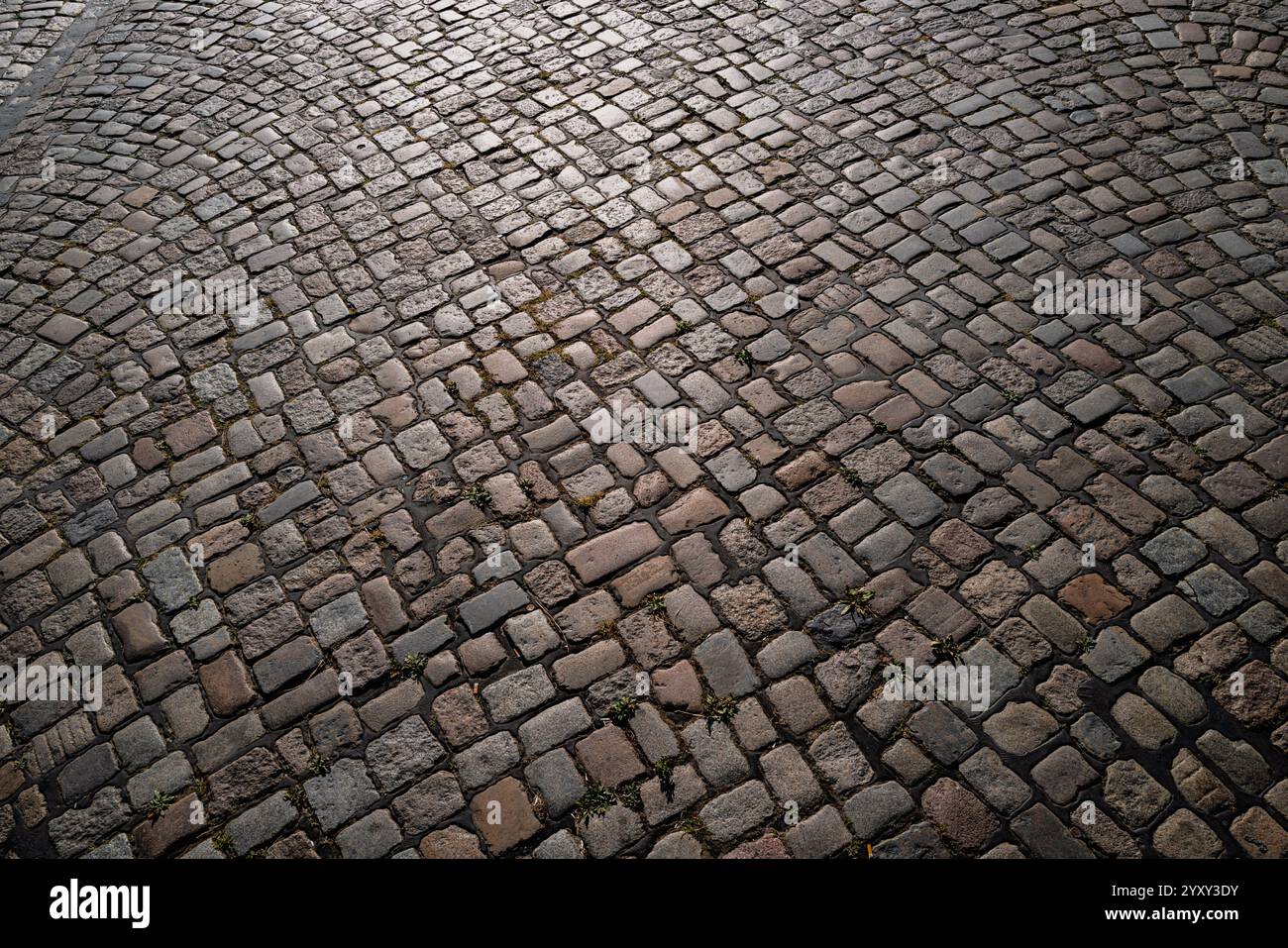 Pavement road. Background of bricks road. Stone cladding pavement ...