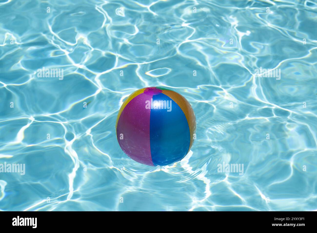 Pool floats. Beach ball in swimming pool. Summer background. Colorful ...