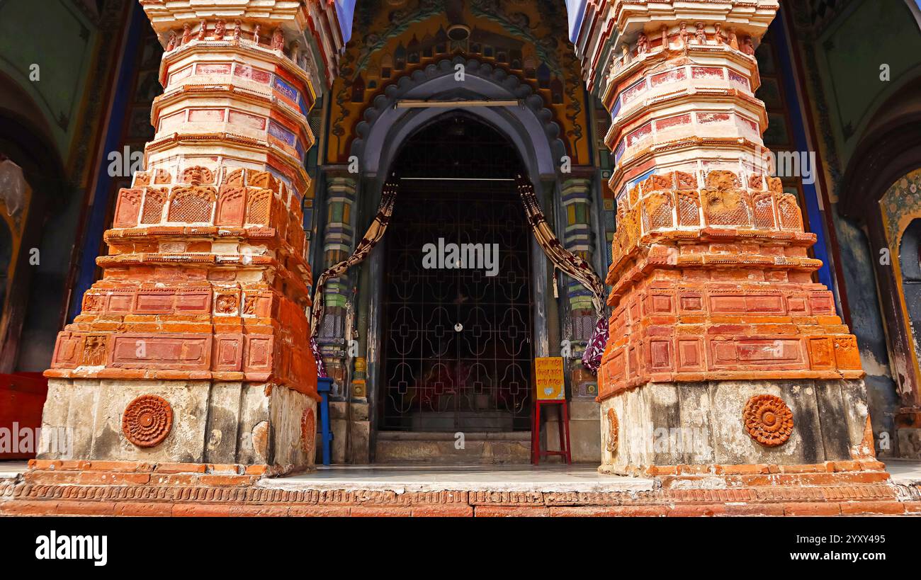 Detailed terracotta-ornamented pillars of Krishna Chandraji's Temple, a ...
