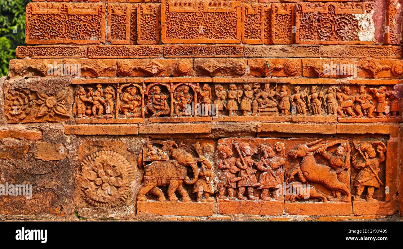 Terracotta carvings depicting war scenes and aspects of human life on ...