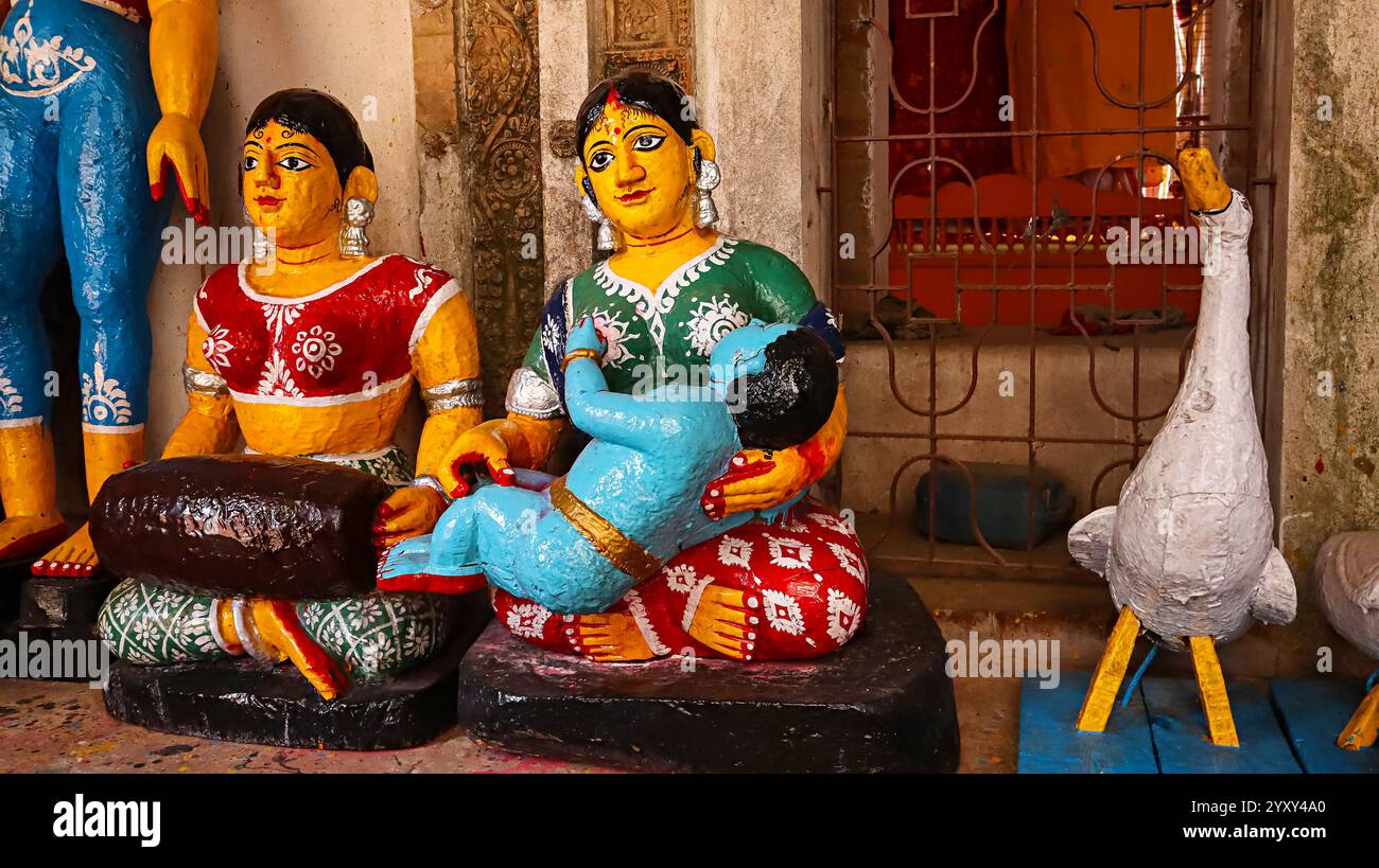 Statues depicting women breastfeeding, playing the dholak, and a duck ...