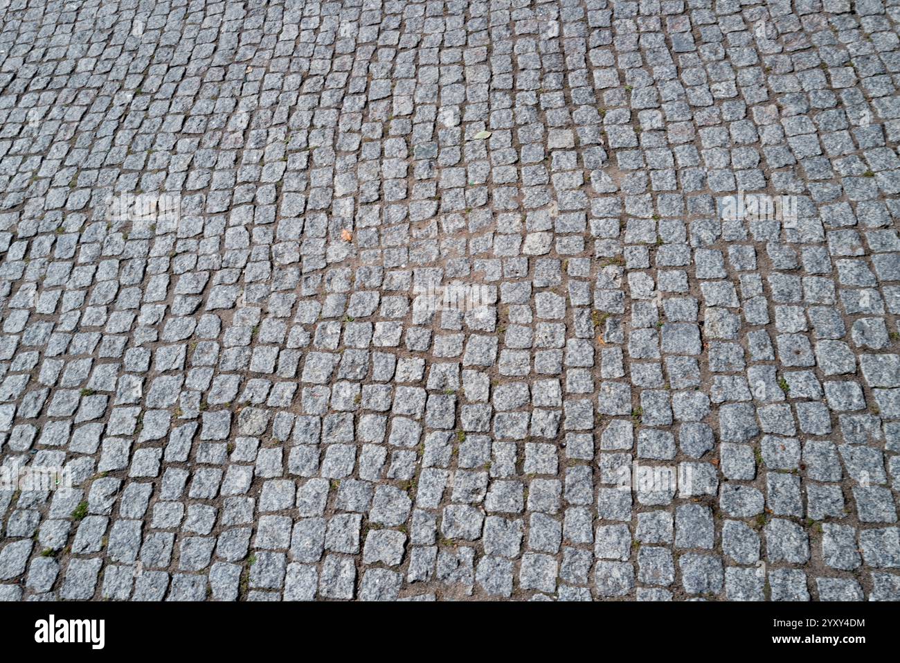 Stone road. Pavement texture. Stonework background for design. Granite cobblestoned pavement ...