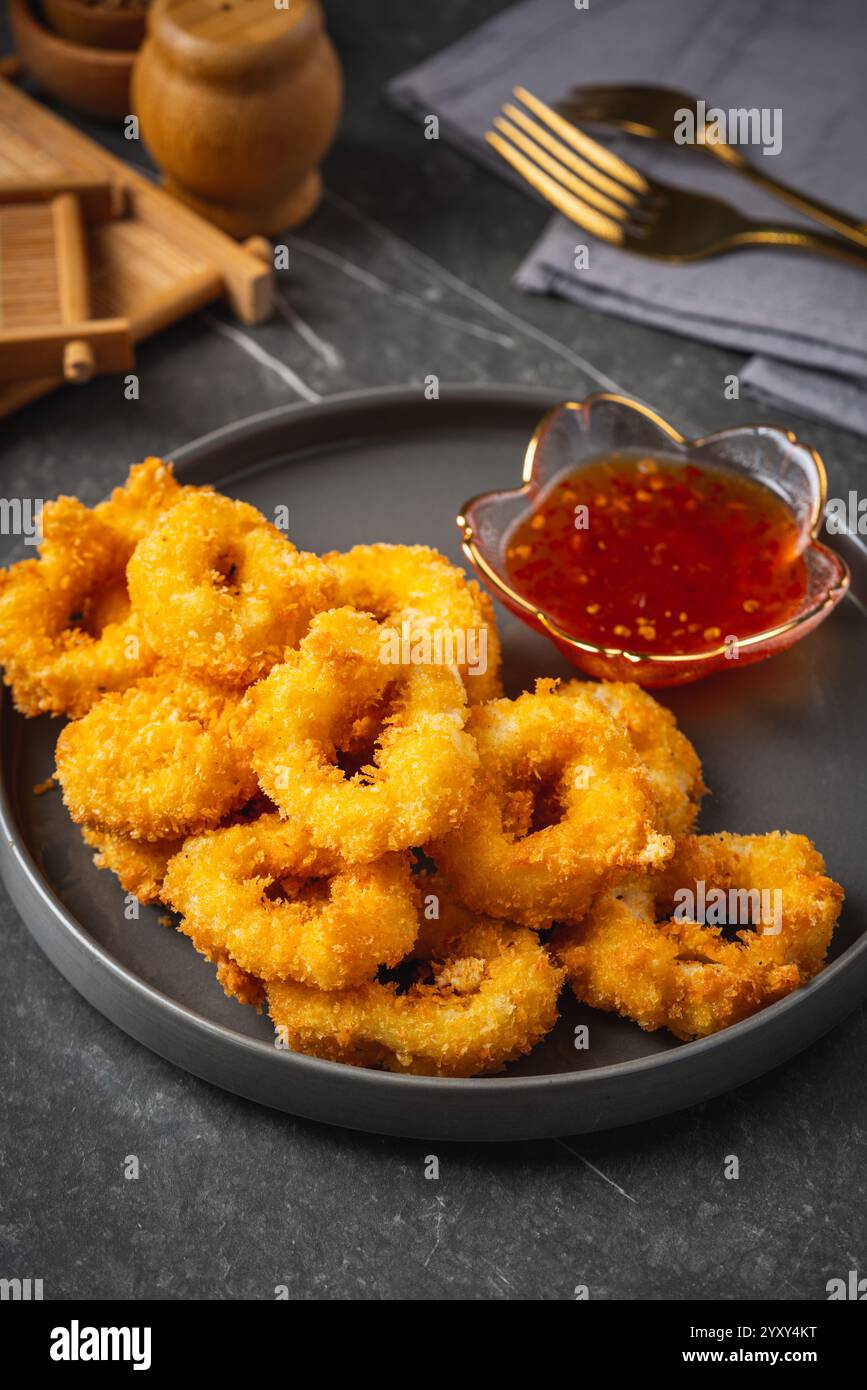 Deep fried squid rings breaded with thai sauce Stock Photo - Alamy