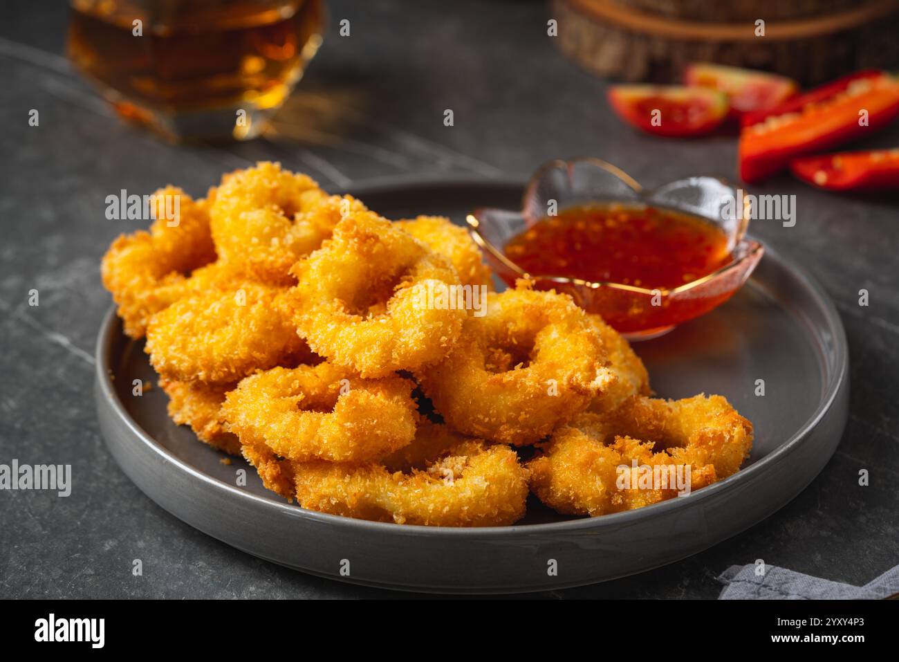 Deep fried squid rings breaded with thai sauce Stock Photo - Alamy