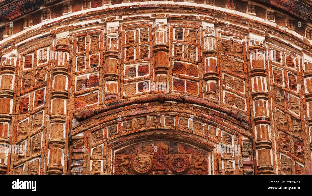 Depictions of Hindu deities and intricate carvings on the Basuli Temple ...